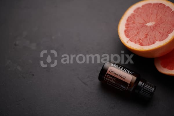 Doterra Grapefruit Product And Grapefruit Pieces Black Stock Photo ...
